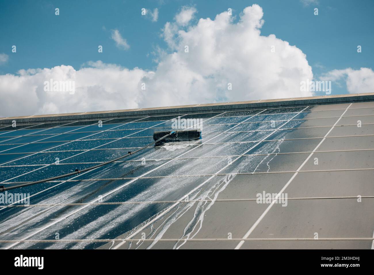 A close-up shot of solar system panel cleaning process Stock Photo - Alamy