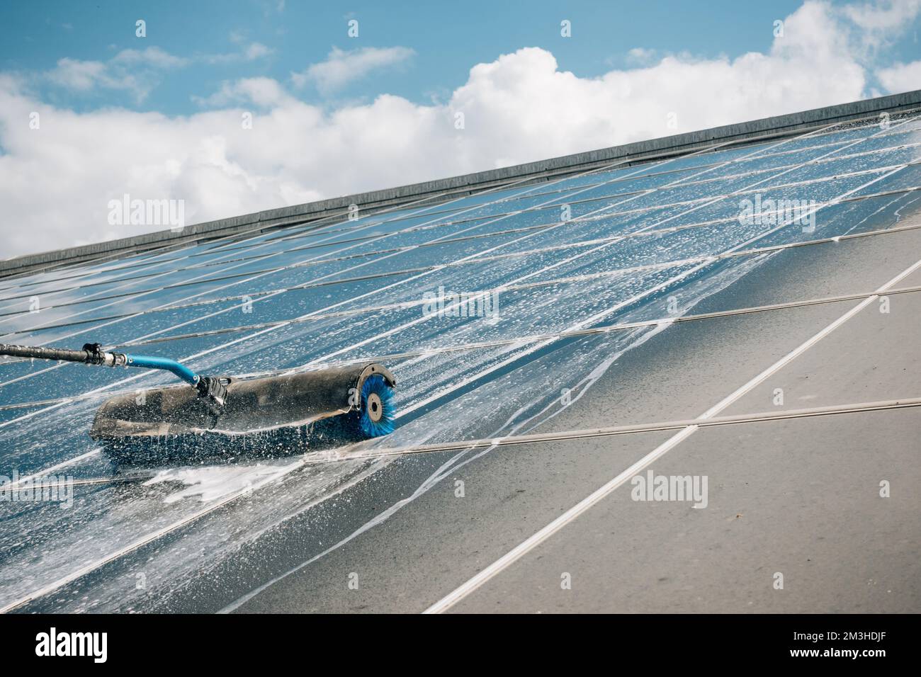 A close-up shot of solar system panel cleaning proces Stock Photo - Alamy