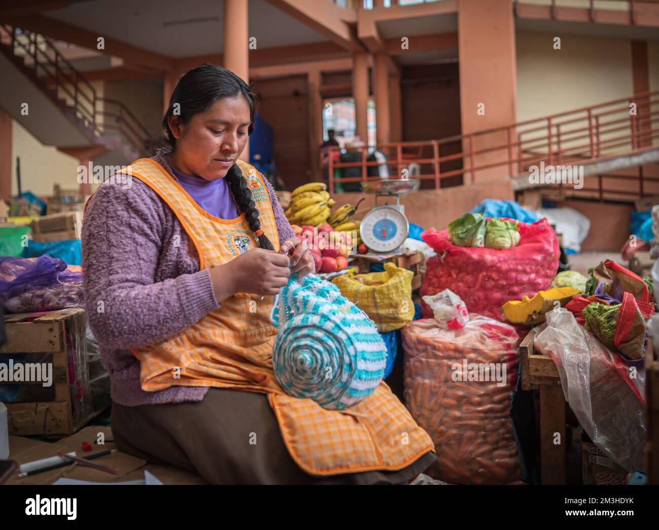 A local woman selling goods in a market in Peru Stock Photo - Alamy