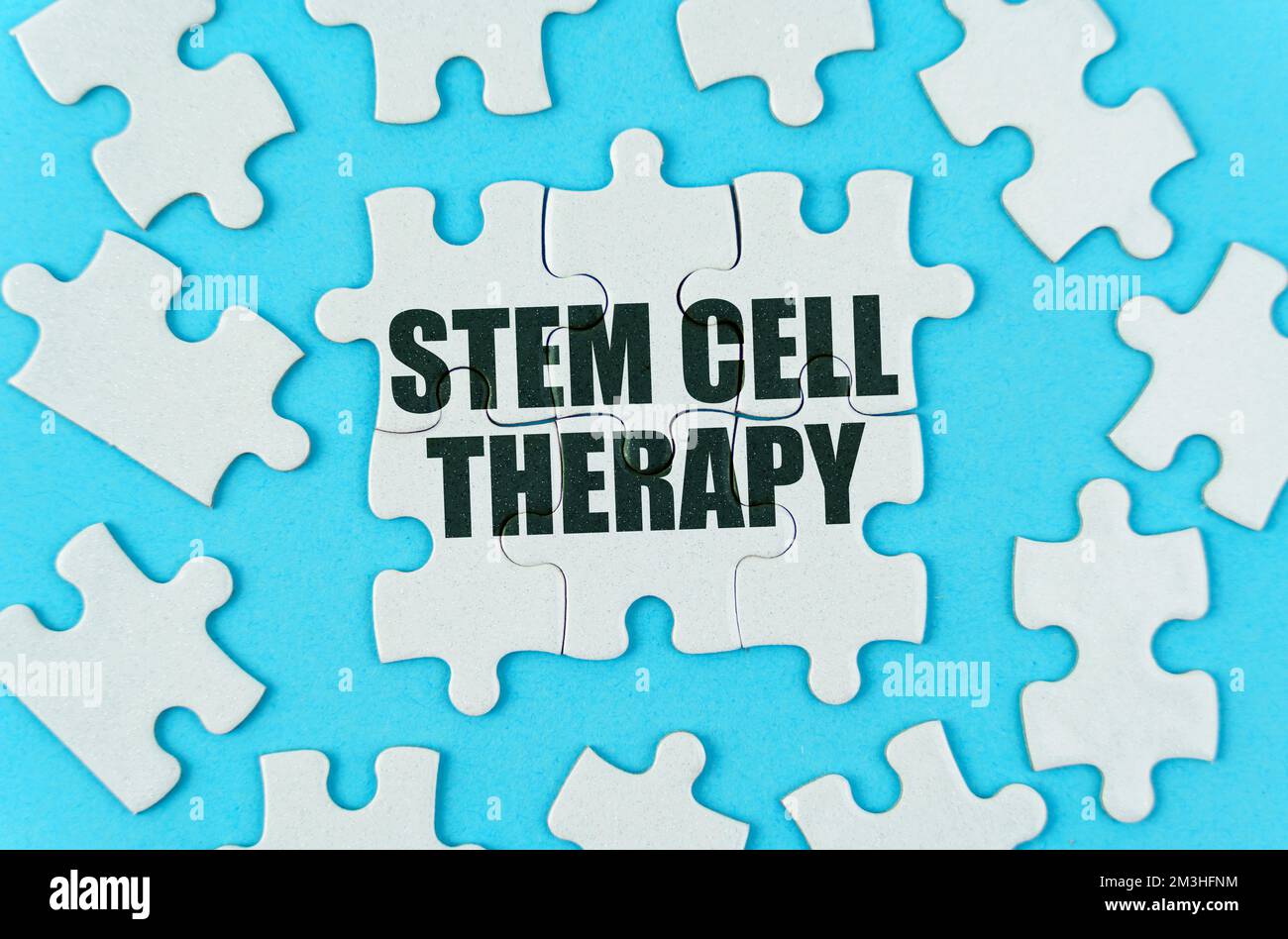 Medical concept. On a blue background are white puzzles with the ...