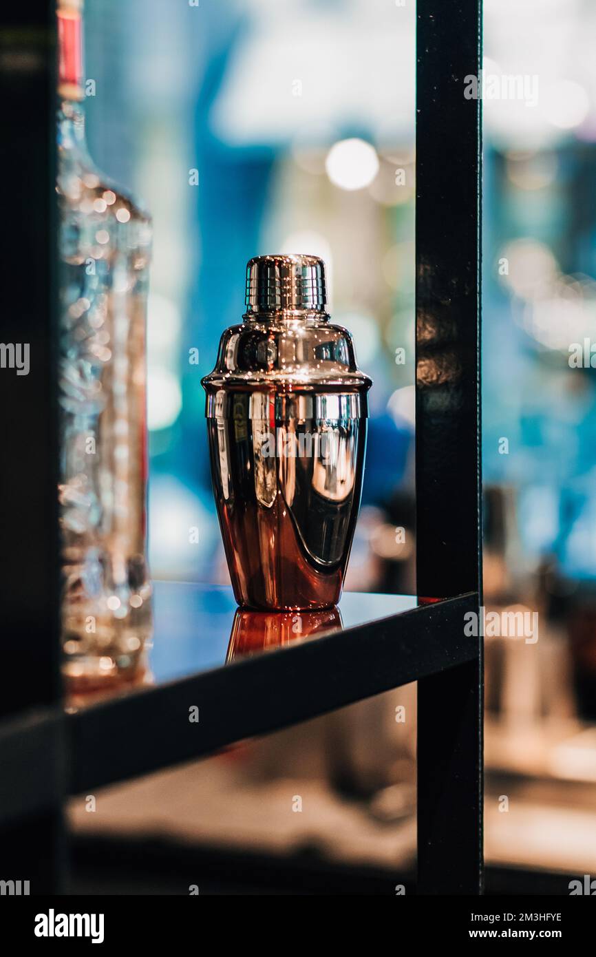 A vertical shot of a cocktail shaker on a shelf Stock Photo - Alamy