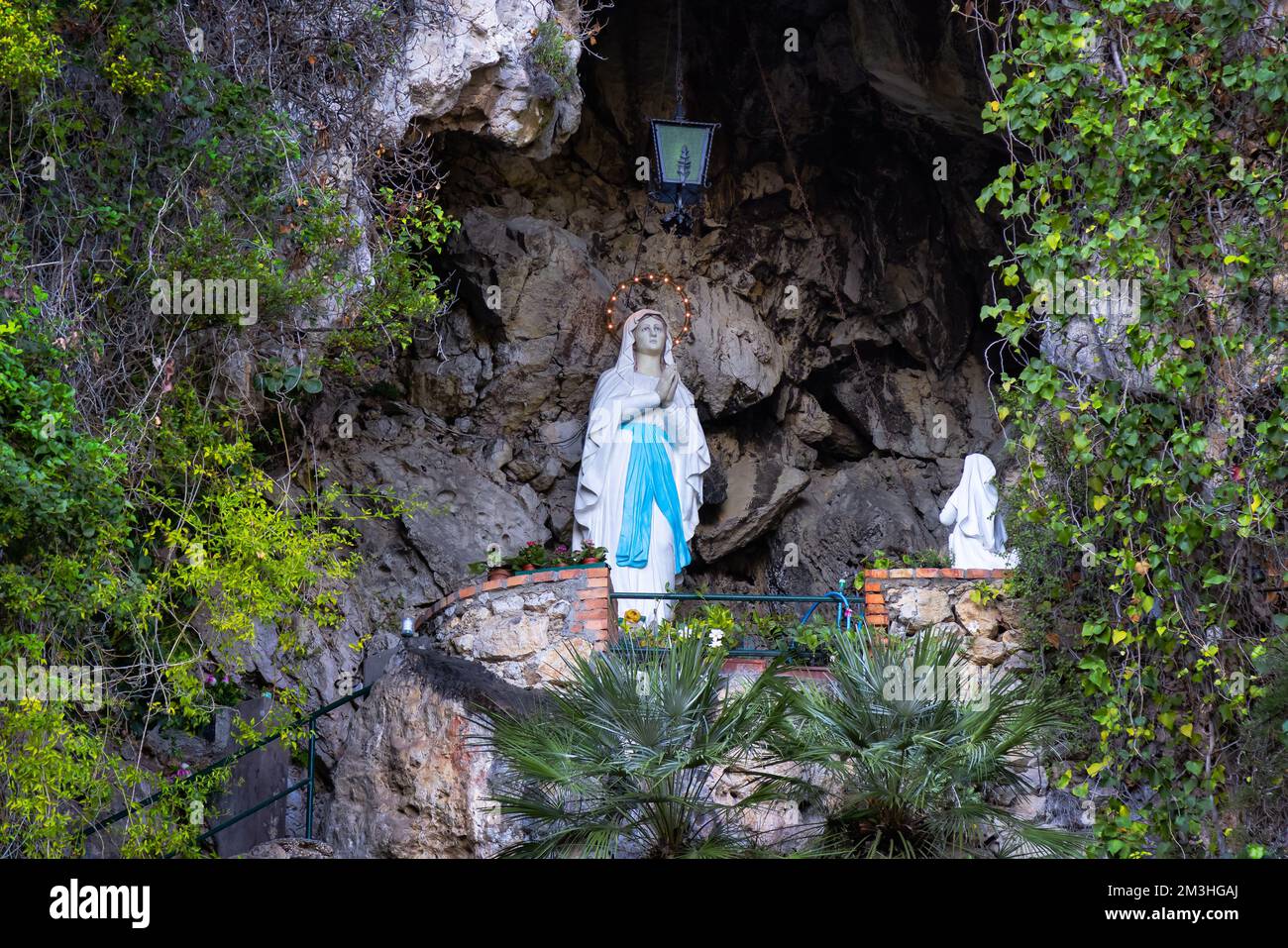 Statue of Mother Mary in a rocky cave. Saint. Capri Island, Italy Stock ...