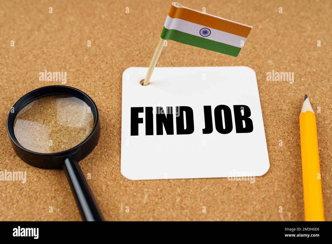 On the table is the flag of India, a pencil, a magnifying glass and a ...