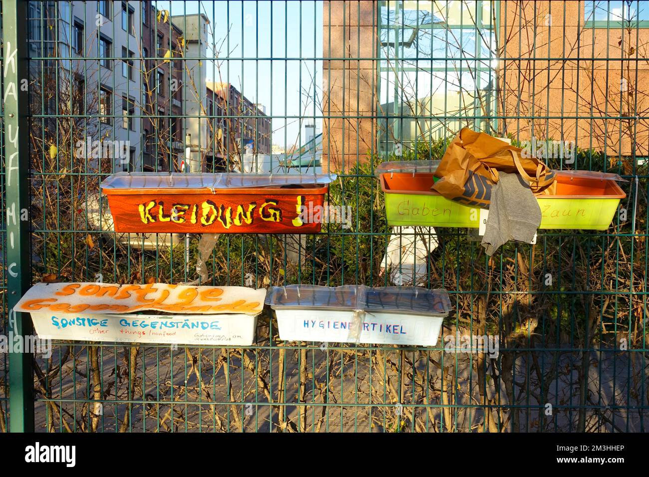 Gifts for poor homeless people, fence, Berlin Stock Photo - Alamy