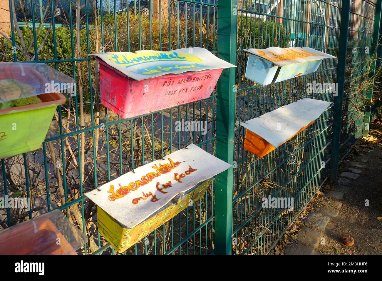 Gifts for poor homeless people, fence, Berlin Stock Photo - Alamy