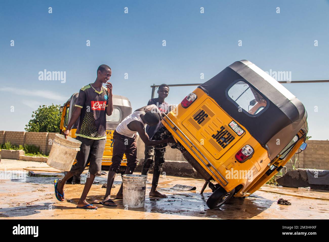 Car wash service in Africa, young boys working hard and cleaning local ...