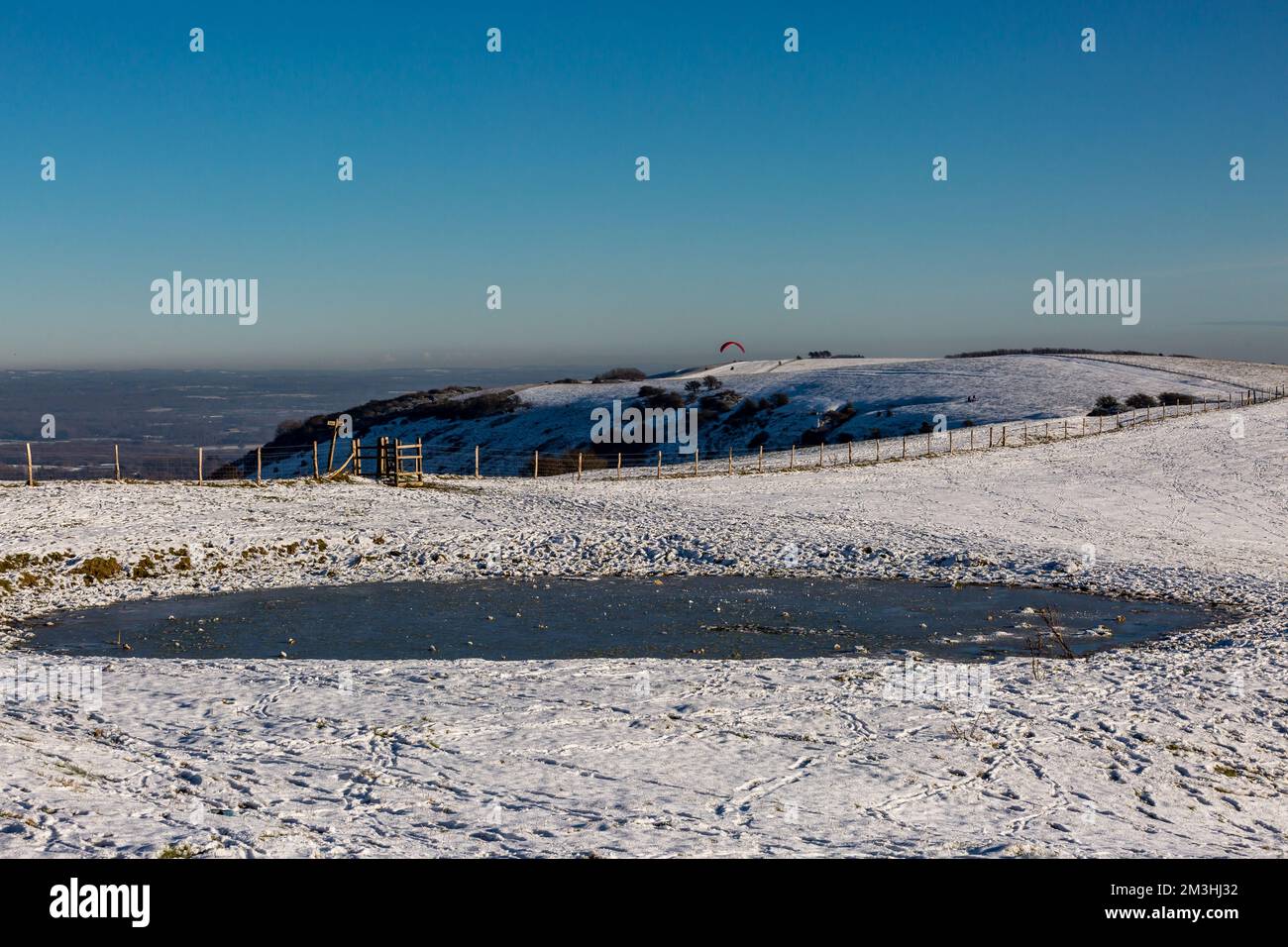 A snowy scene on Ditchling Beacon in the South Downs with a blue sky ...