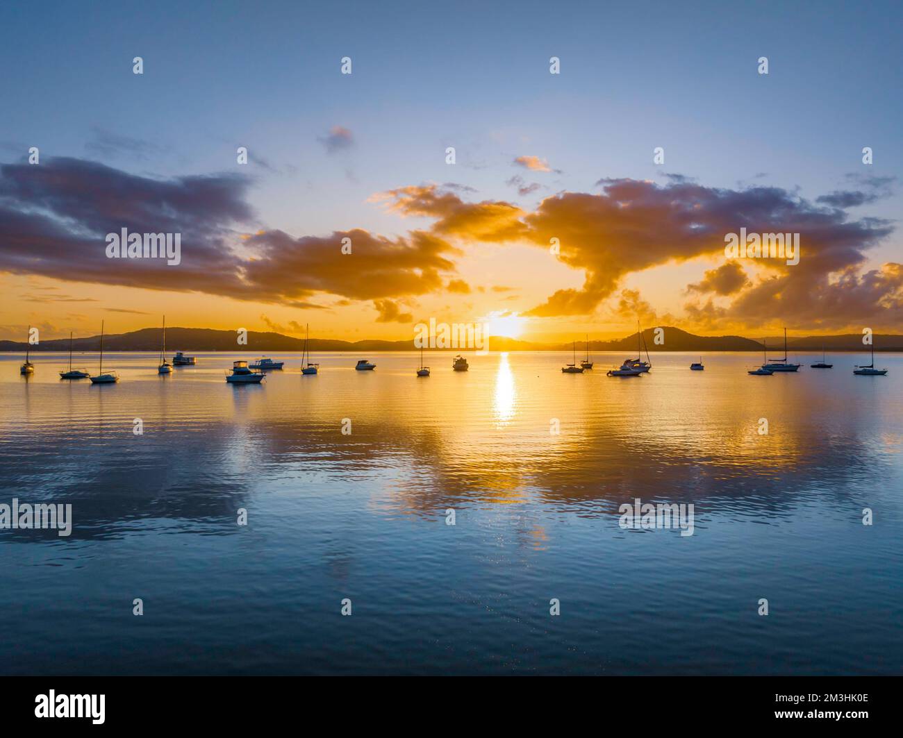 Sunrise, clouds and boat reflections on Brisbane Water at Koolewong and ...