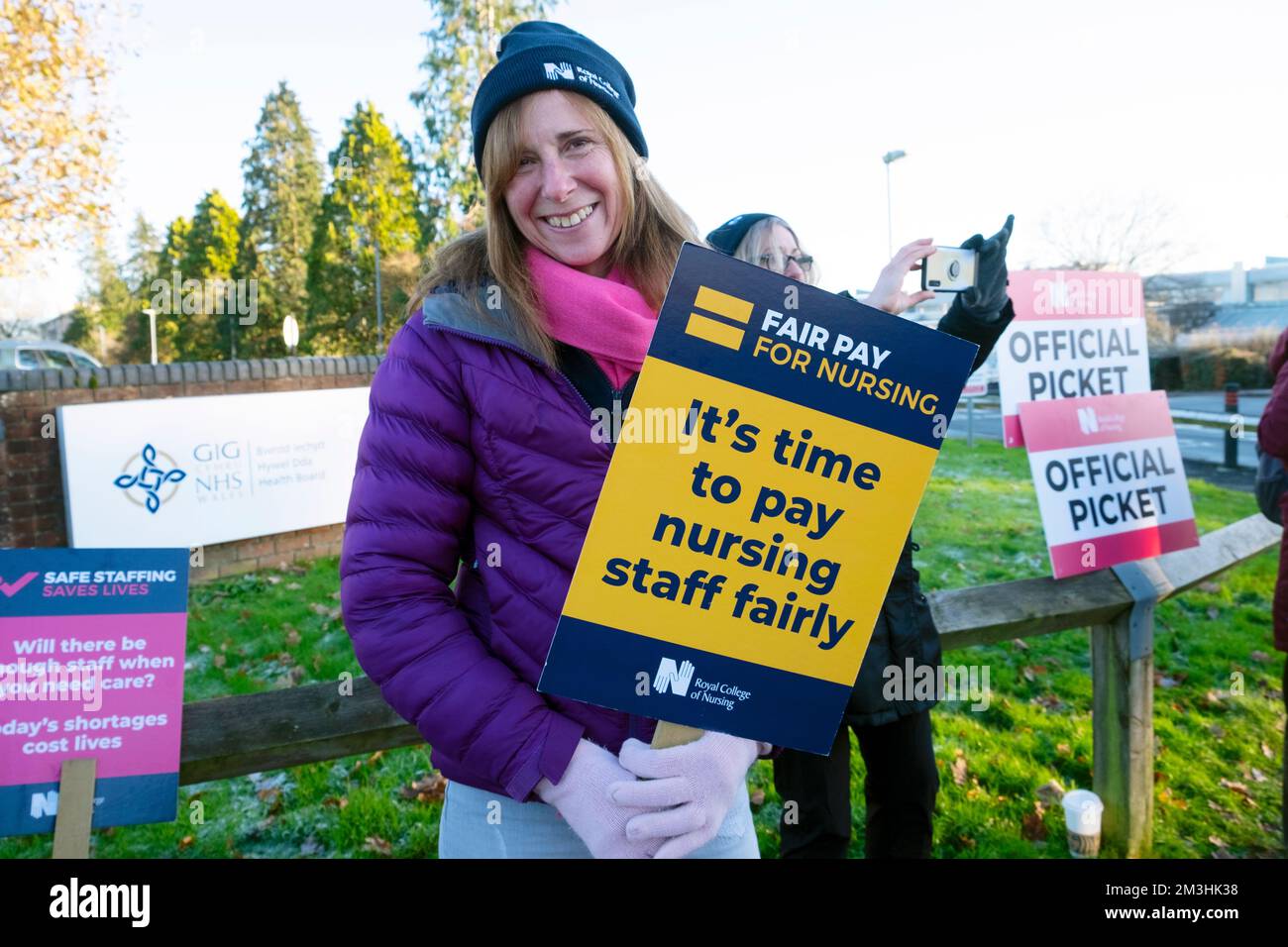 Nurses strike on picket line with protest placards stand in the cold ...