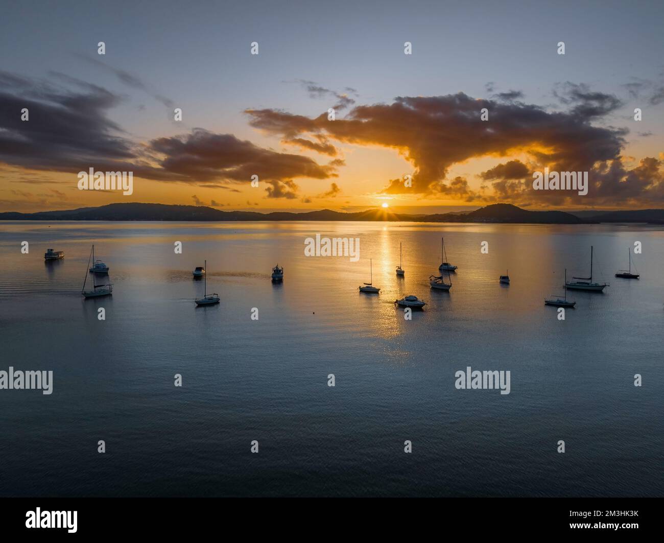 Sunrise, clouds and boat reflections on Brisbane Water at Koolewong and ...