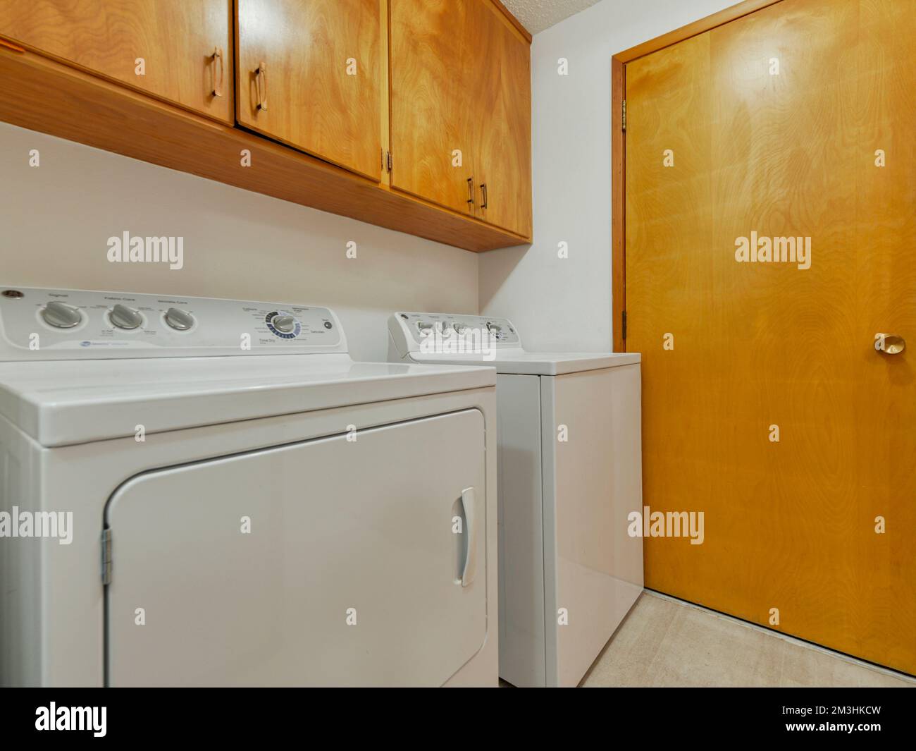 Modern residential laundry room interior Stock Photo - Alamy