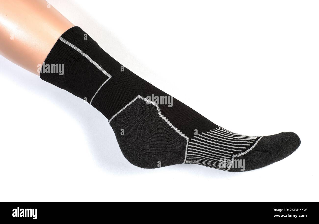 Close-up of sock on mannequin leg isolated on white background Stock ...