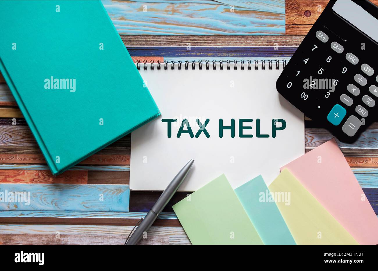 Notepad with text TAX AID with pen, office tools and calculator on ...