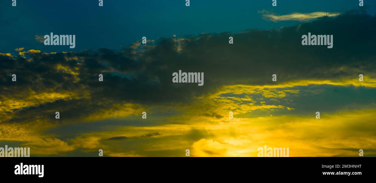 Sunset with strong color clouds light rays and other atmospheric ...