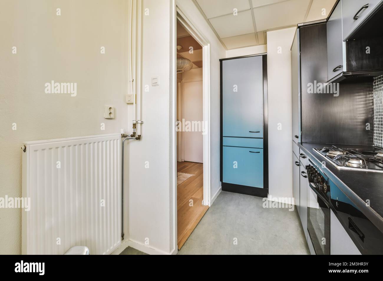 a kitchen area with an oven, refrigerator and sink in the same room on ...