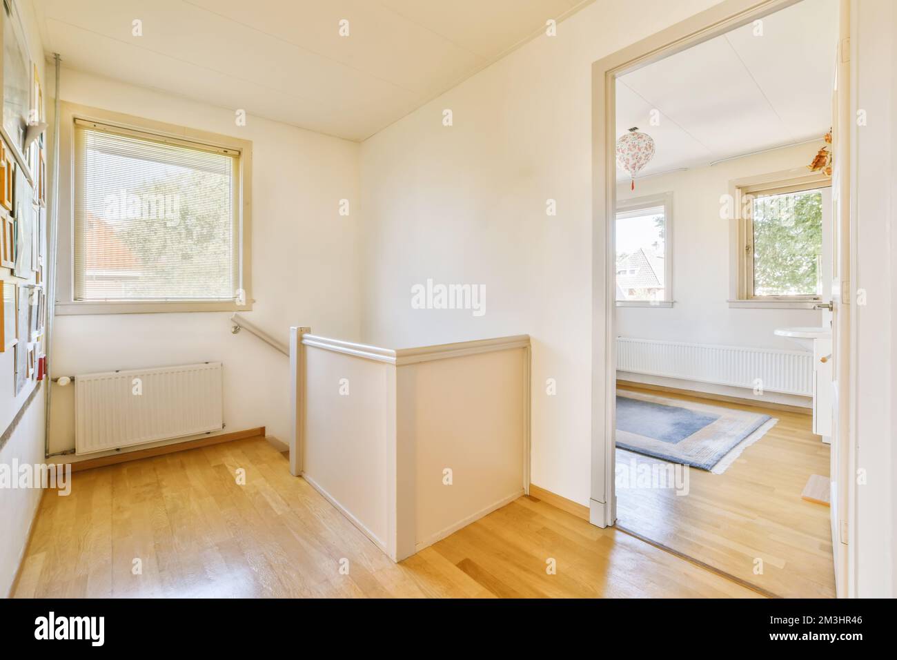 an empty room with wood flooring and white walls in the room is very ...