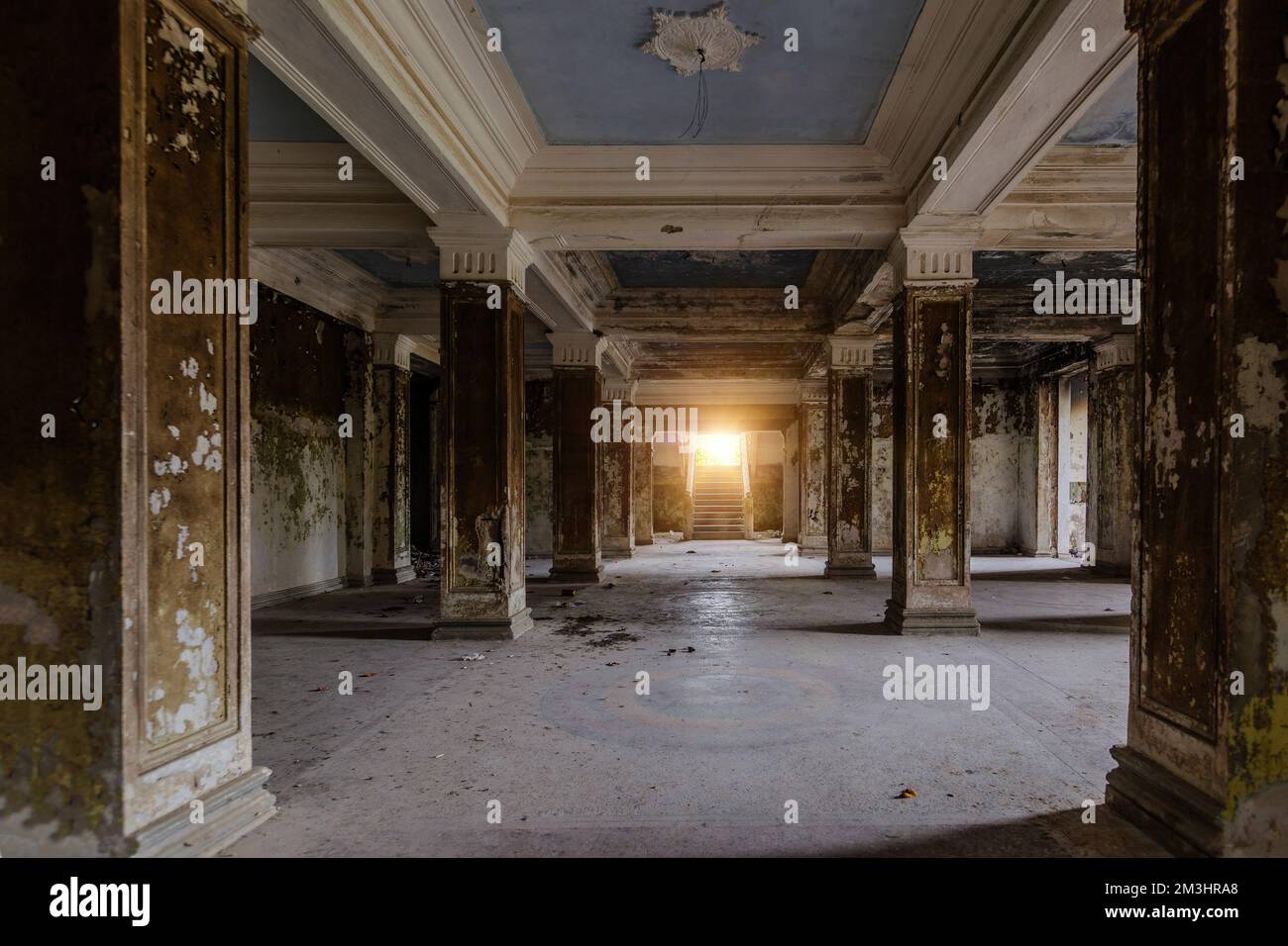 Large hall with columns in old abandoned mansion Stock Photo - Alamy