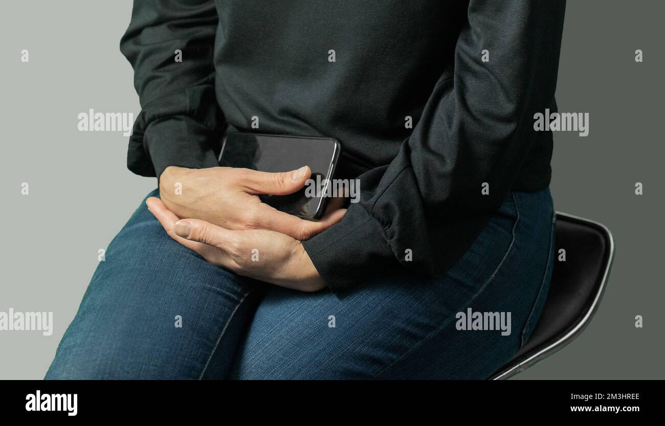 Hands of a woman sitting on a chair and waiting for. close-up Stock ...