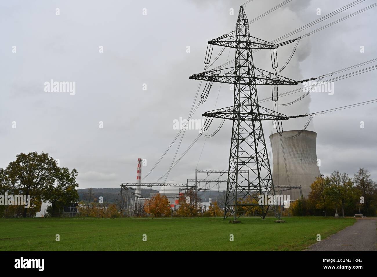 Electric pillar in front of a nuclear power plant with smoke cooling ...