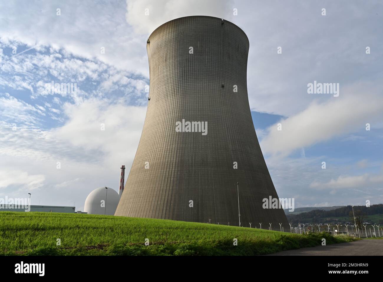 Huge cooling tower of a nuclear power plant observed from vicinity ...