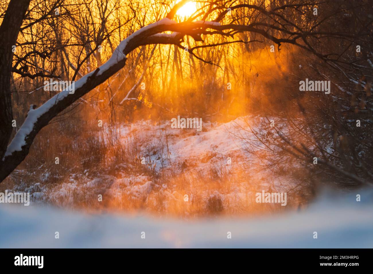 beautiful sunset and steam over the winter river Stock Photo - Alamy