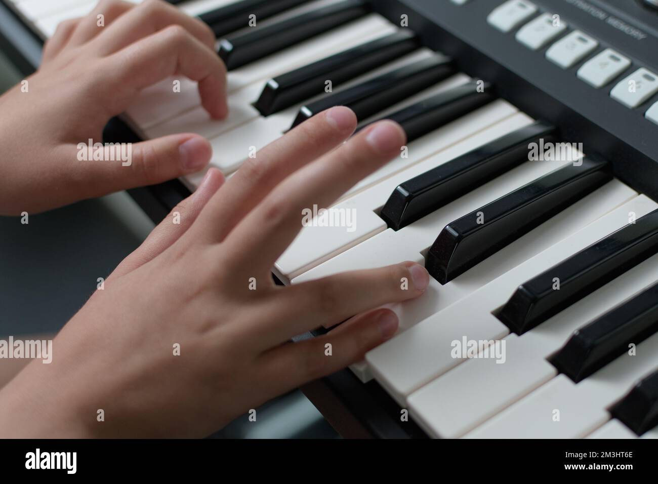 Fingers of a child on the piano keyboard. diagonal position Stock Photo ...