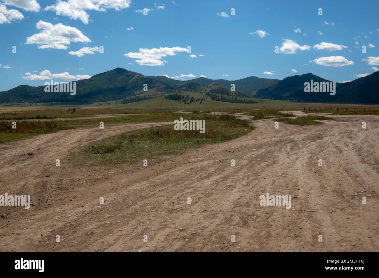 Open fields and majestic mountains in the background. Rural countryside ...