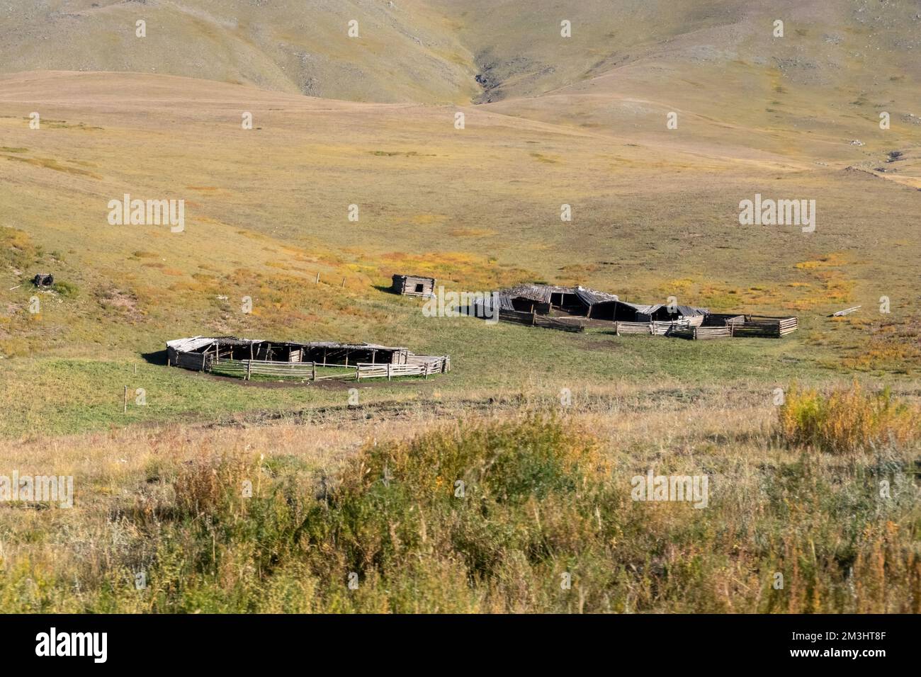 Empty paddock on a foothill in the rural countryside on a sunny day ...