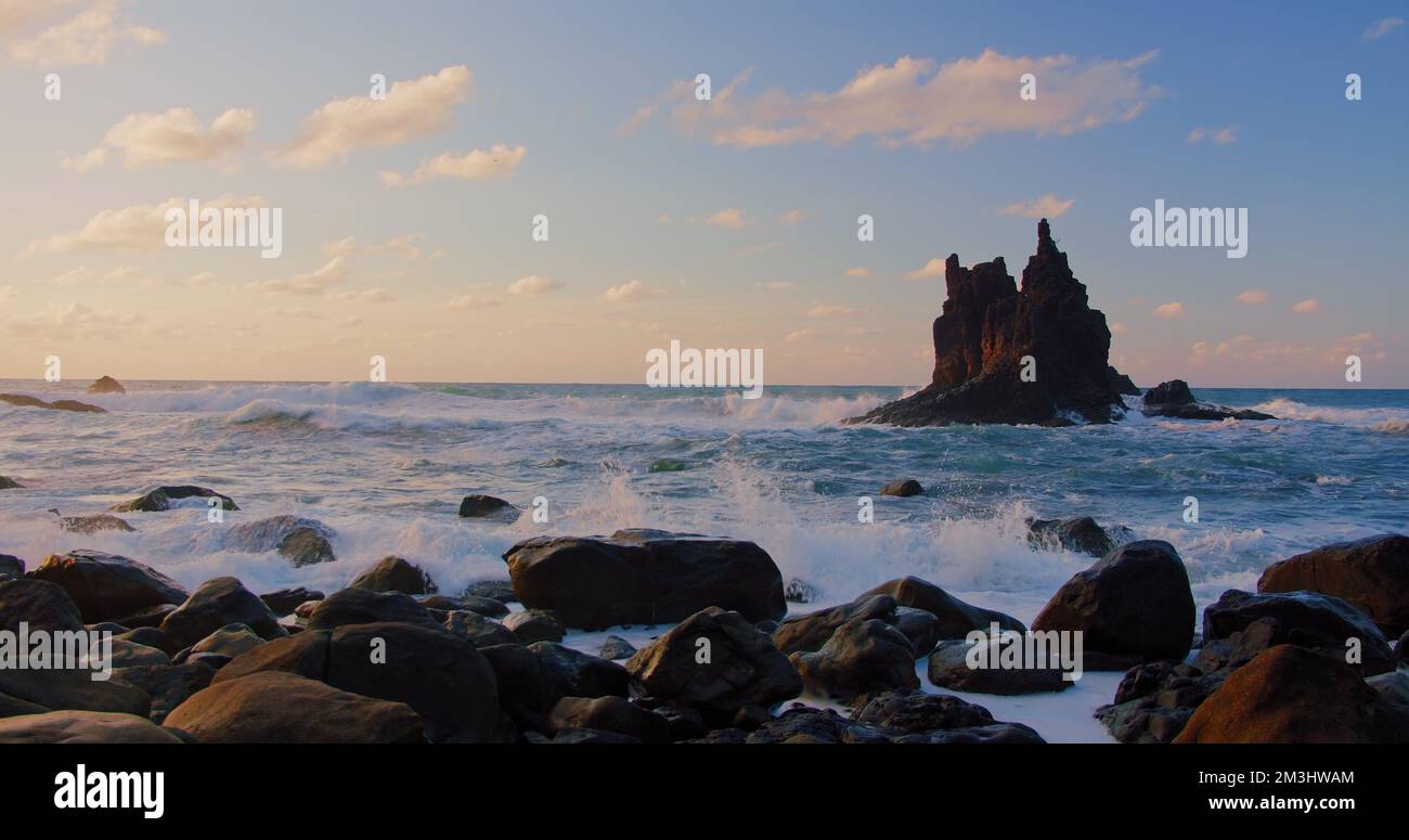 Beautiful natural sea landscape with rocky volcanic beach. Rolling big ...