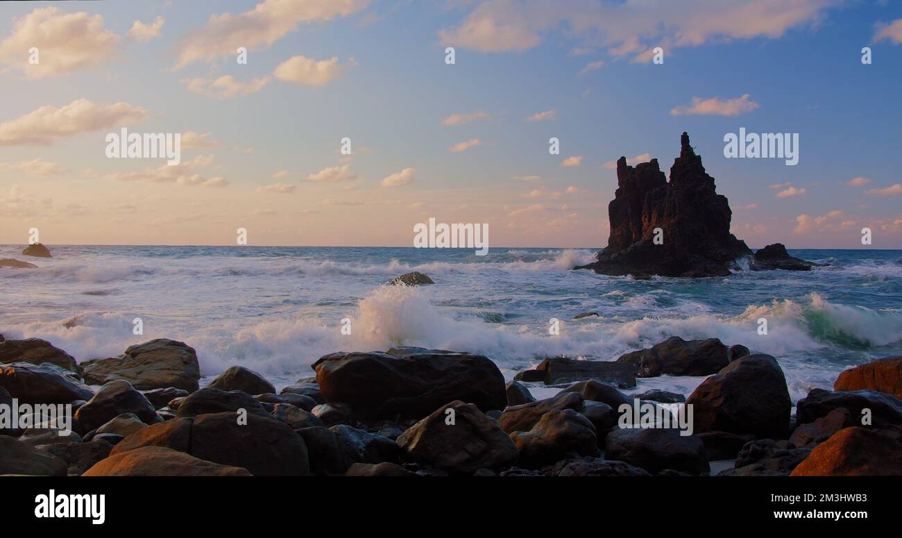 Beautiful natural sea landscape with rocky volcanic beach. Rolling big ...