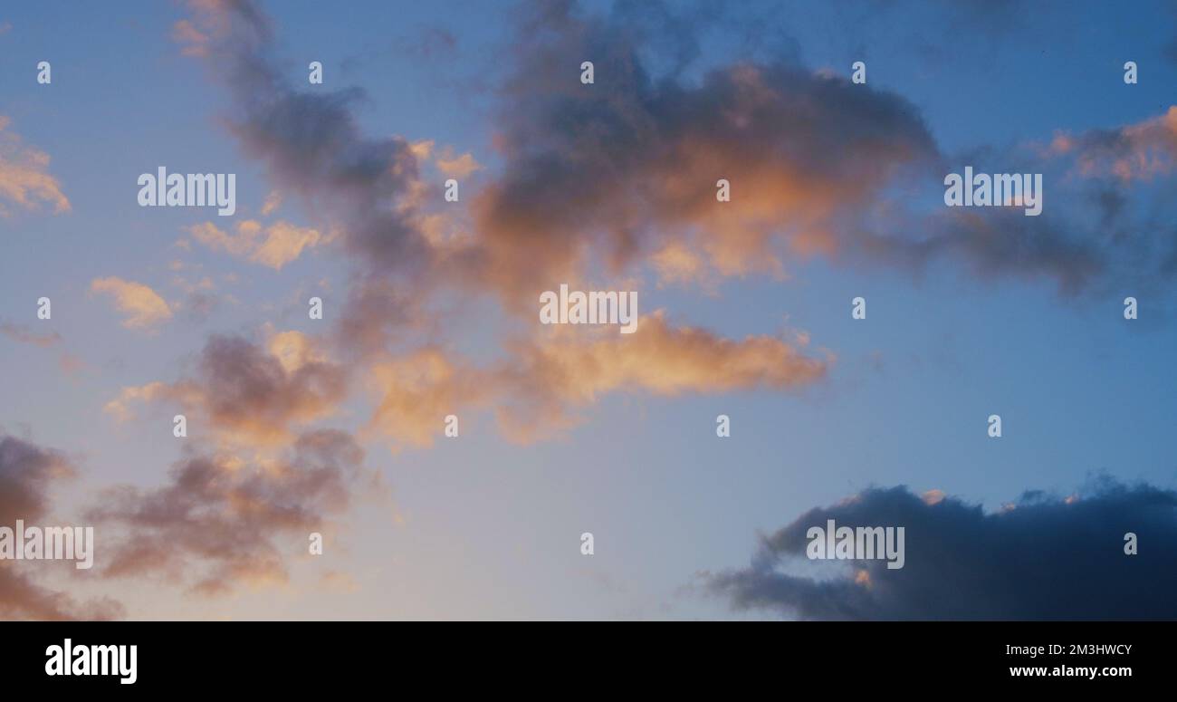 Sunset sky only. Coloured clouds over ocean. Sunset in impressive fire ...