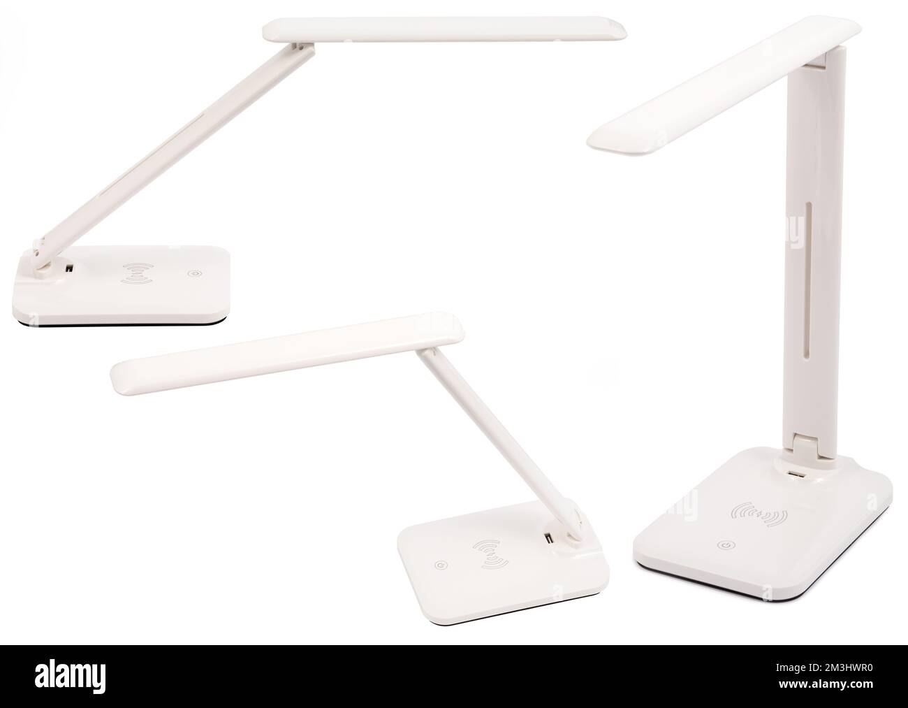 The USB desk lamp with wireless charger isolated on a white background ...