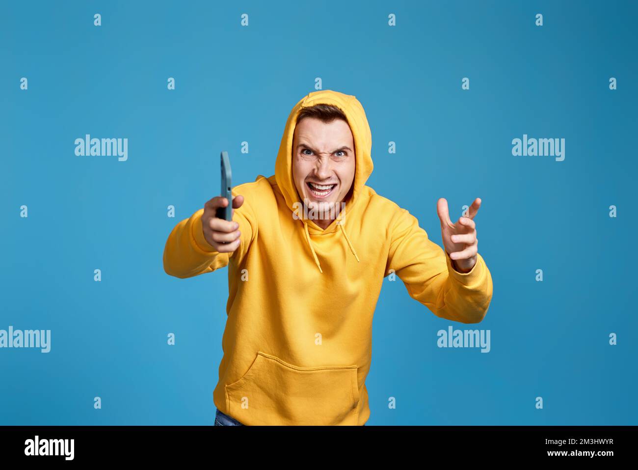 Angry man in yellow hi-res stock photography and images - Alamy