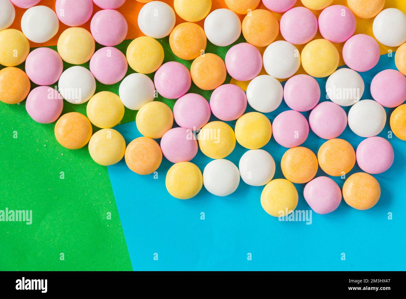 A beautiful circle candies on the colorful surface background Stock ...