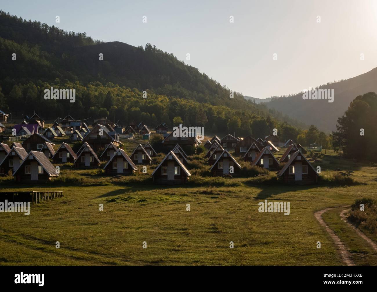 Cute small village houses on a foothill on a sunny day. Rural nomadic ...