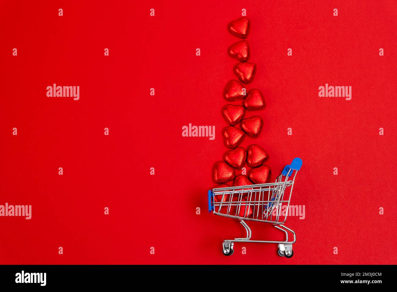 red festive Christmas background with a supermarket cart Stock Photo ...