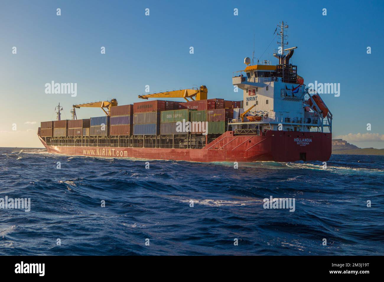 A Container ship sailing in Curacao Stock Photo - Alamy
