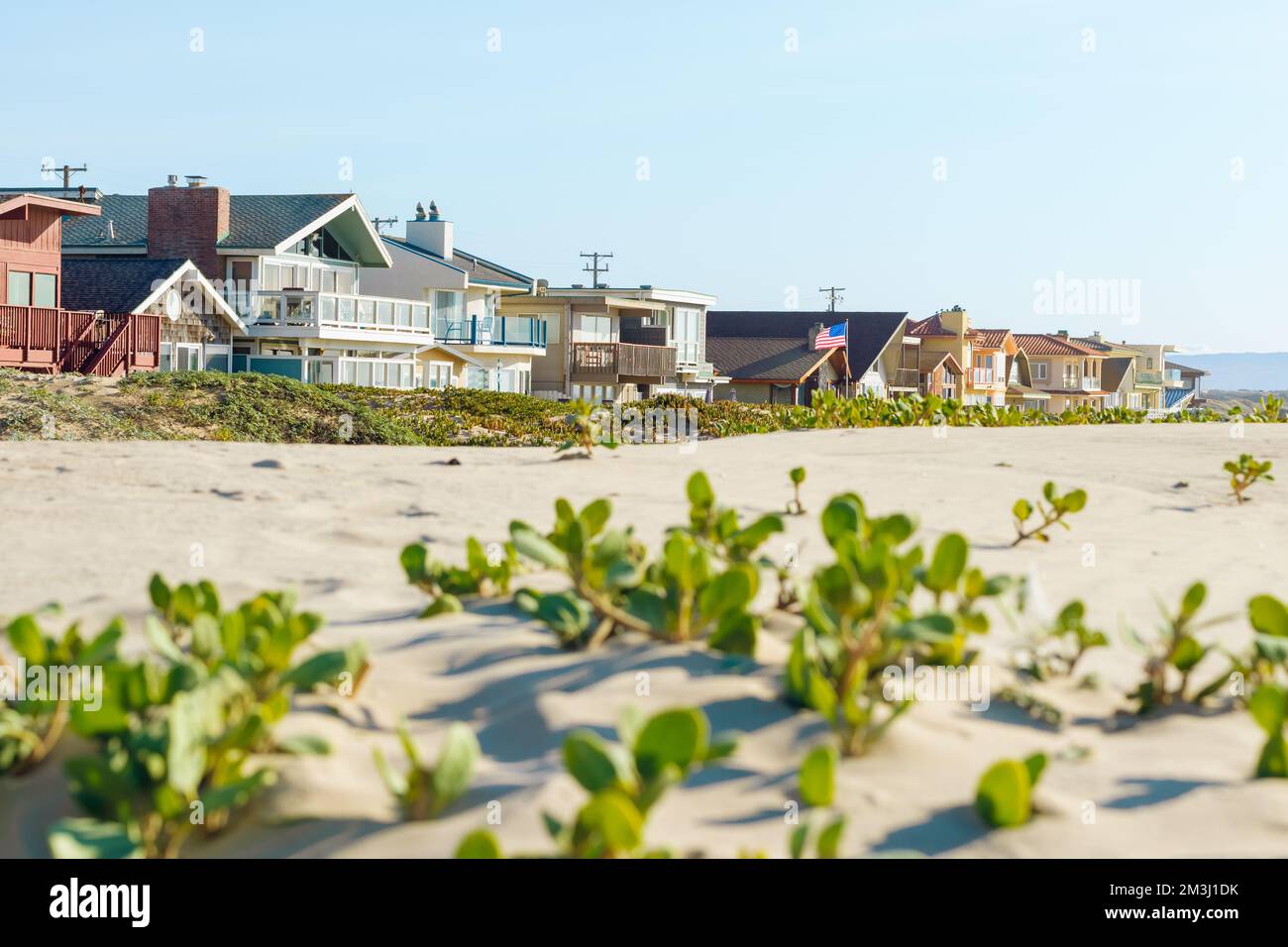 Houses that are set amid coastal sand dunes. Beautiful houses with ...