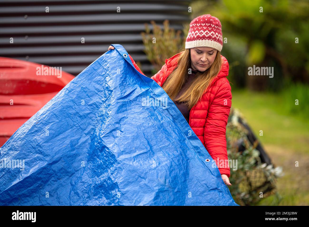 Woman sleeping under a tree hi-res stock photography and images - Alamy