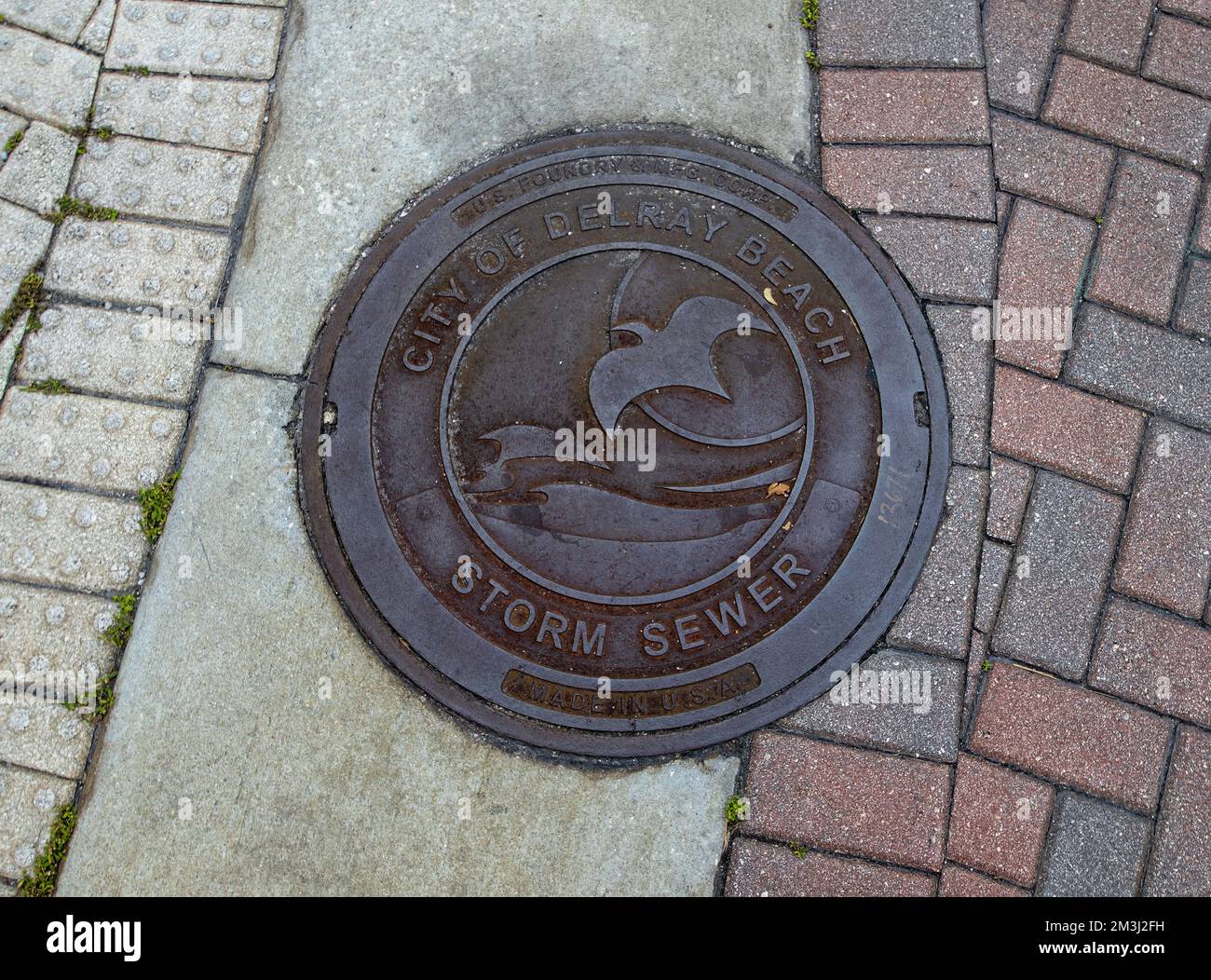 The cover to a storm drain in Delray Beach, Florida, USA Stock Photo ...