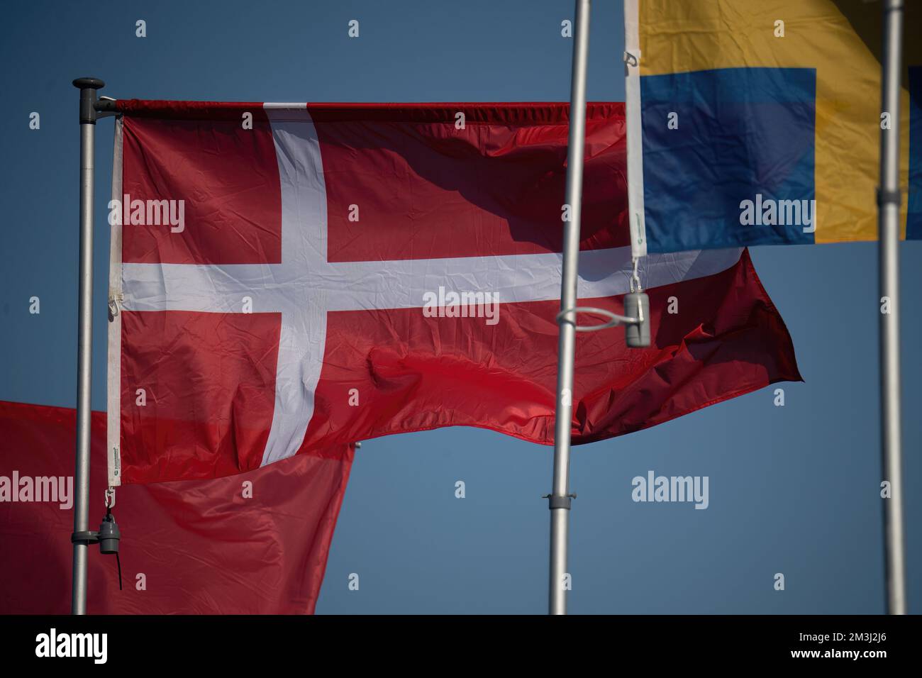 Denmark flag isolated on sky background. close up waving flag of ...