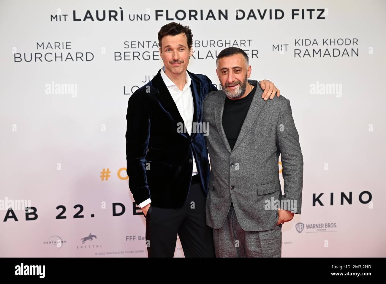 Munich, Germany. 15th Dec, 2022. Actors Florian David Fitz (l) and Kida ...
