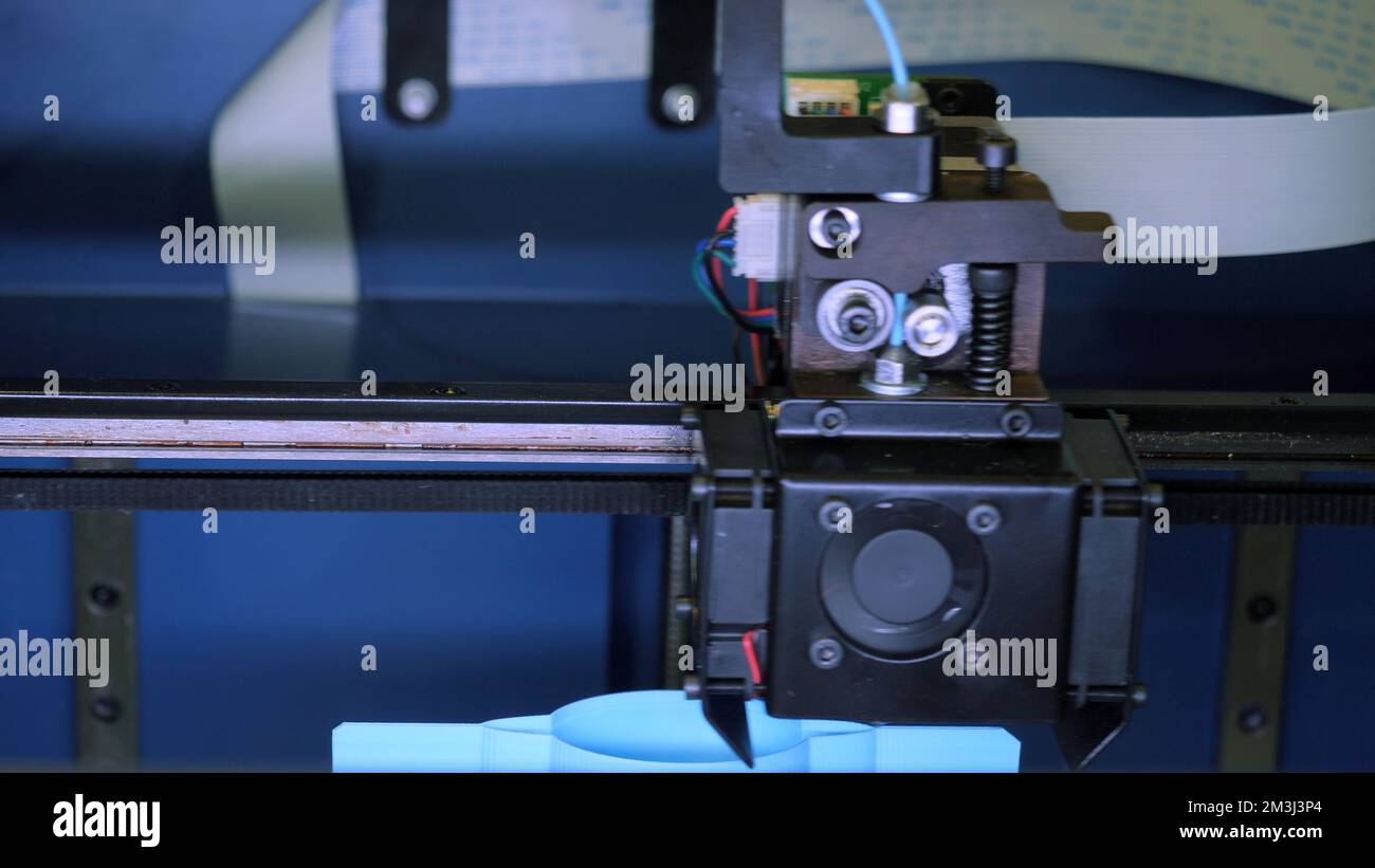 Close-up of moving machine in 3d printer. Media. Creating objects on 3D ...