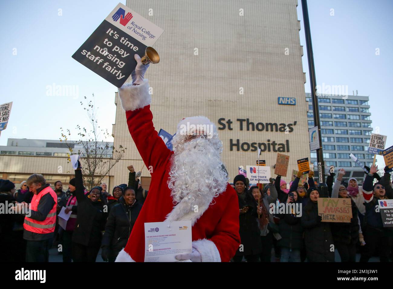 London, UK. 15th Dec, 2022. Santa holds a placard during a protest ...