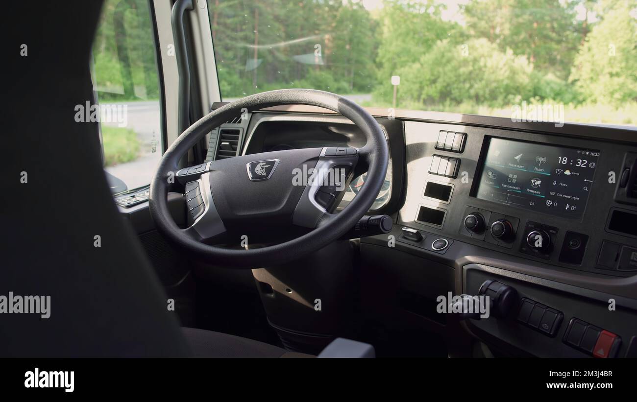 View inside the car. Scene.A big black steering wheel inside a truck ...