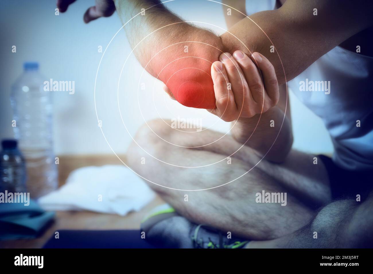 Detail of a representation of pain in the elbow with red color on a ...