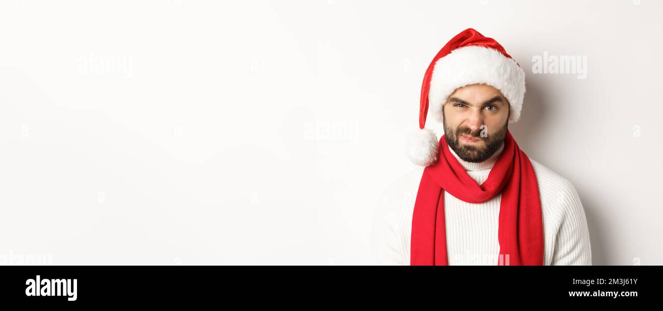 New Year party and winter holidays concept. Close-up of grumpy guy in ...