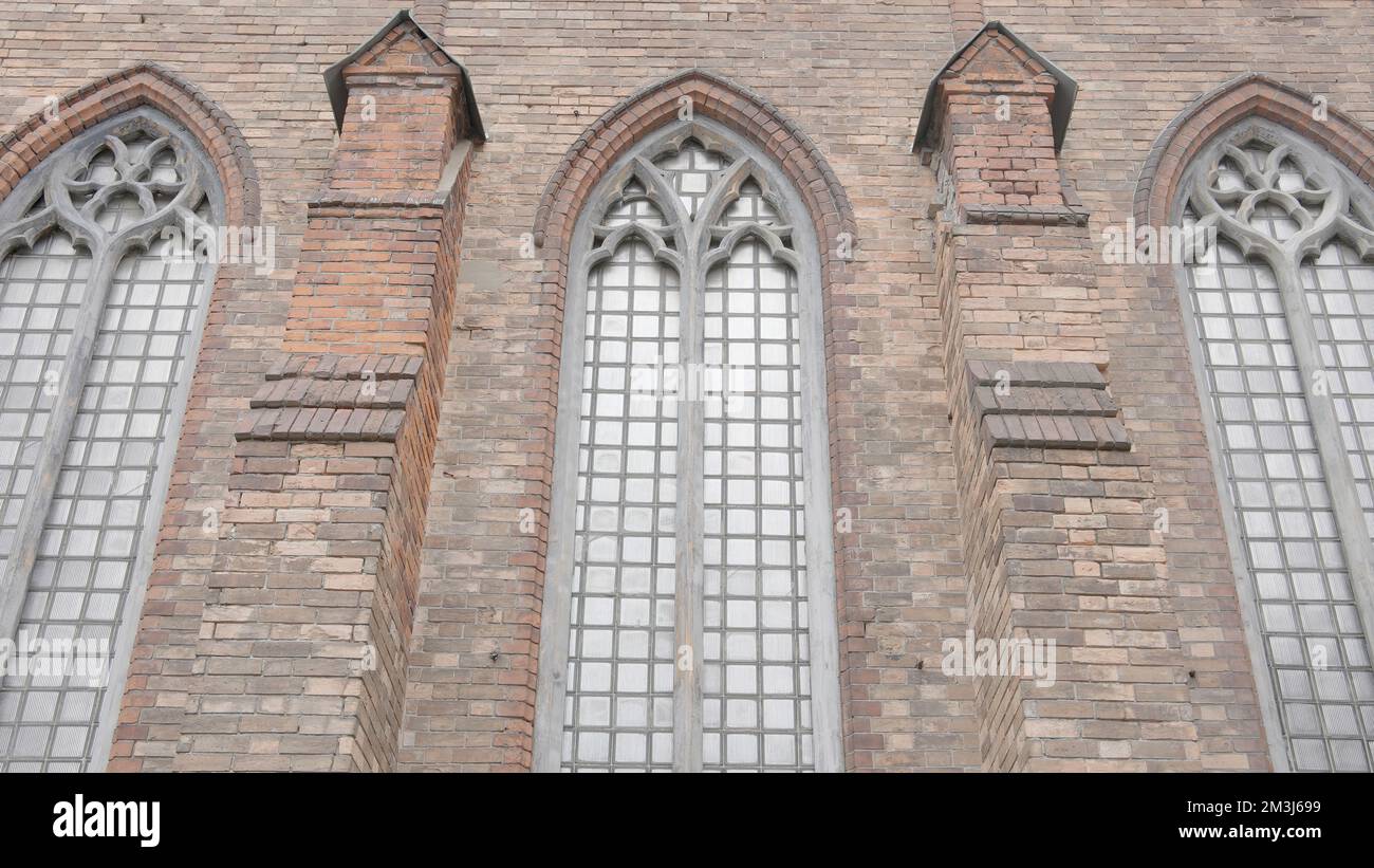 Ancient walls of historic building with high windows. Action. High ...