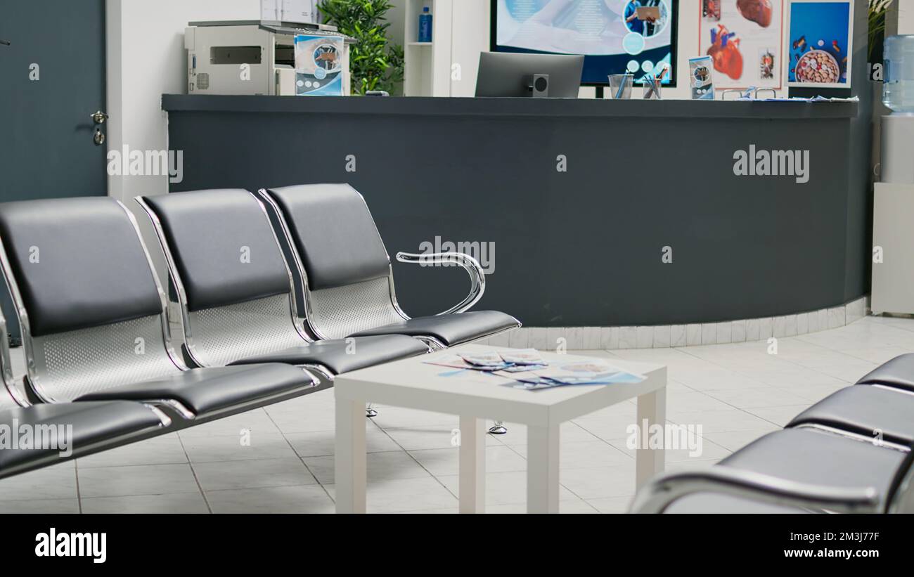 Hospital reception space with waiting area in lobby, administative ...