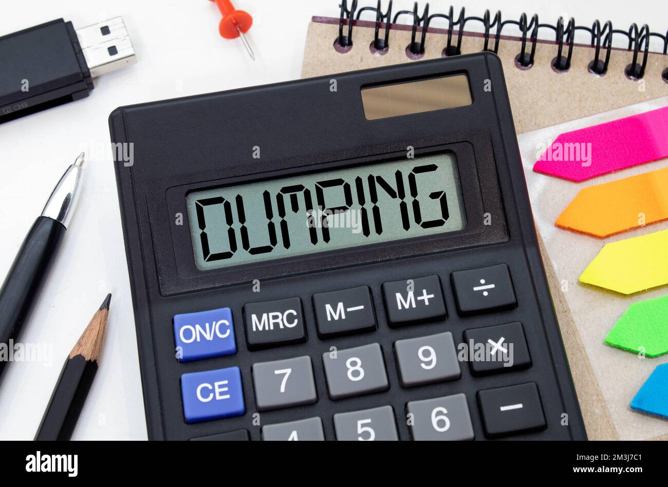 word DUMPING on torn paper Stock Photo - Alamy